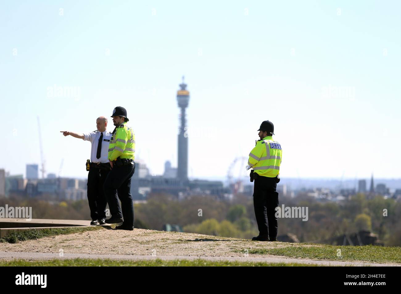 Police officers patrol Primrose Hill, north London, as the UK continues ...