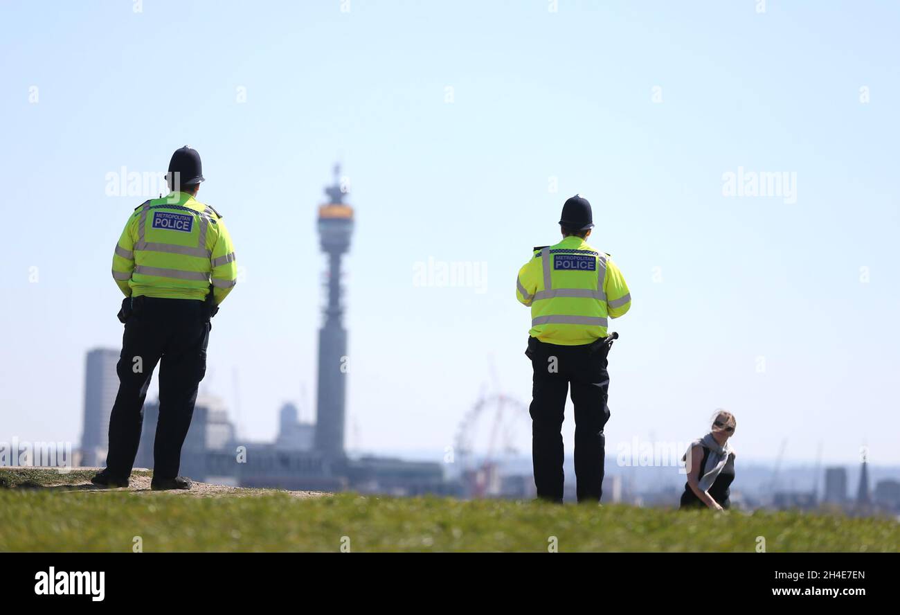 Police officers patrol Primrose Hill, north London, as the UK continues ...
