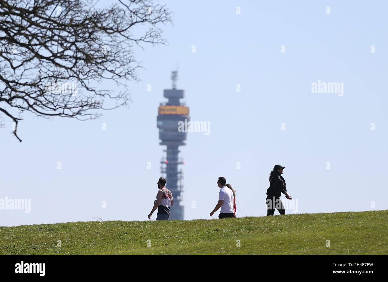 People enjoying the warm weather at Primrose Hill, north London, as the ...