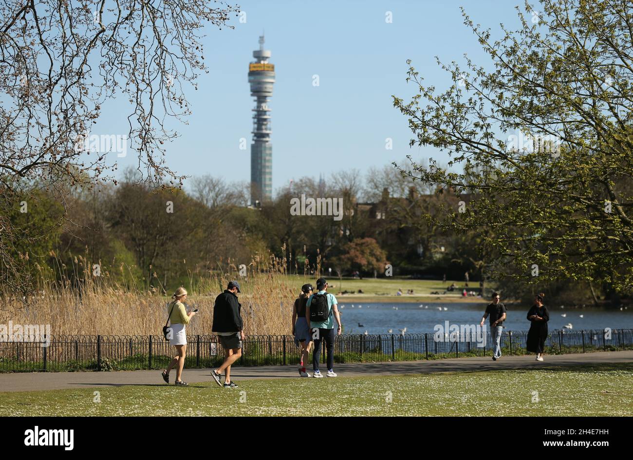 People enjoying the warm weather at Primrose Hill, north London, as the ...