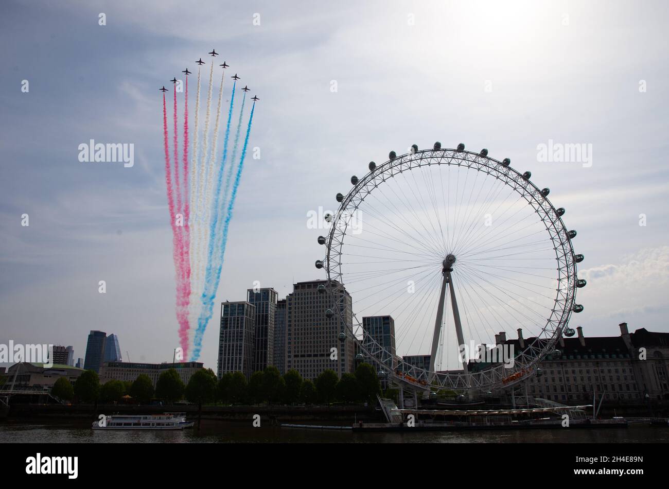 The Royal Air Force Red Arrows pass over the London Eye on the bank of ...