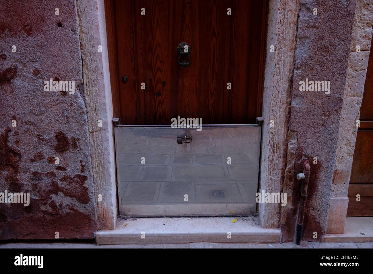 front door with flood defence in Venice italy Stock Photo - Alamy