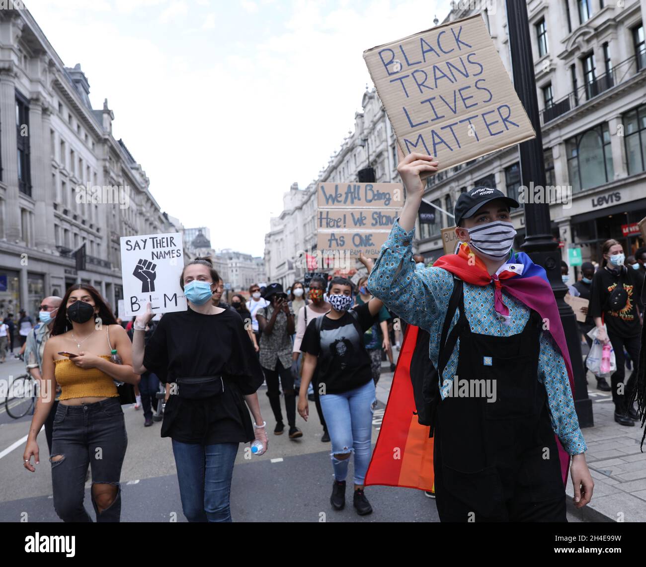 A protester wearing a gay pride rainbow flag during a Black Lives ...
