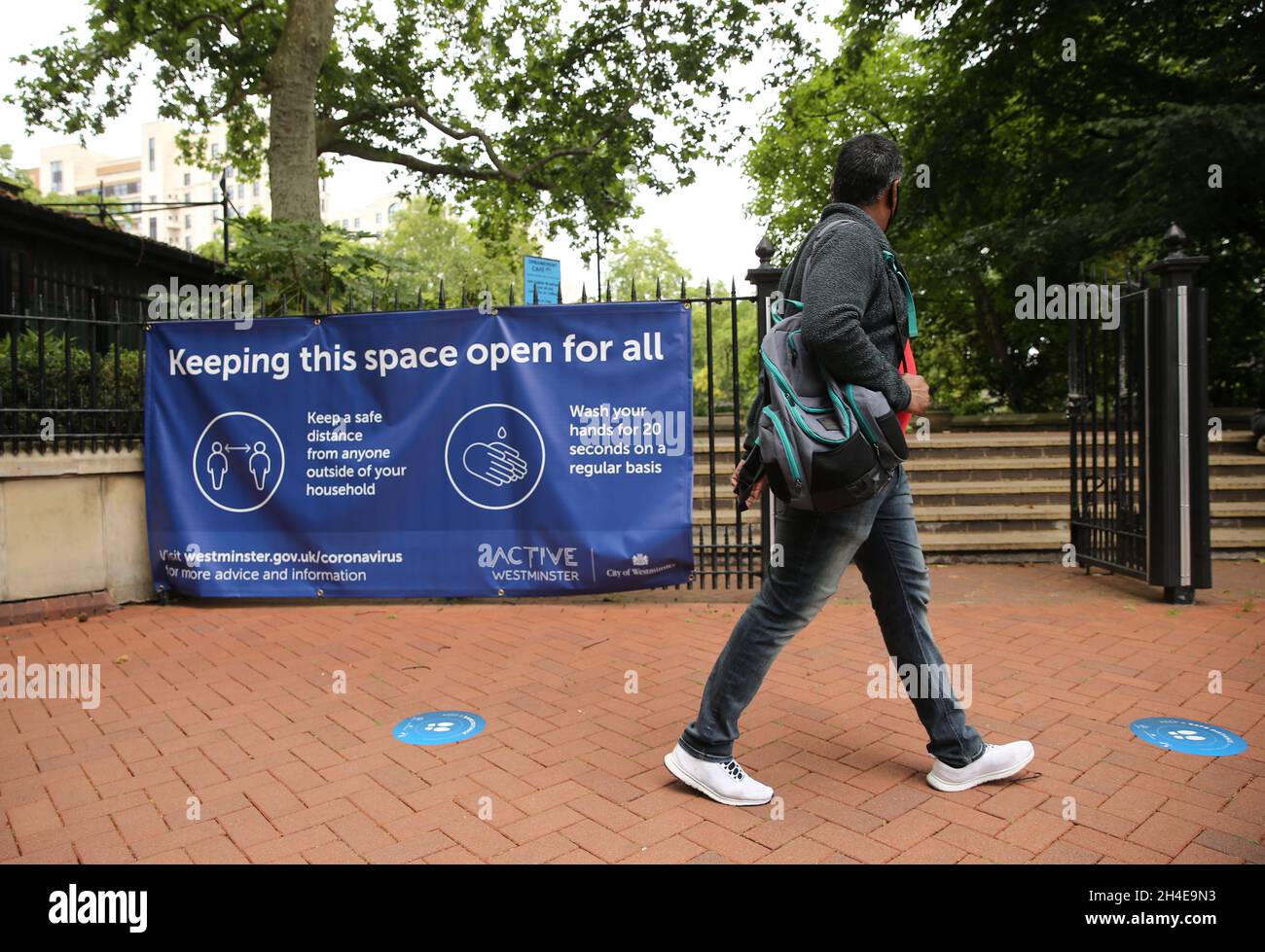 A social distancing sign telling shoppers to keep a safe distance stay ...