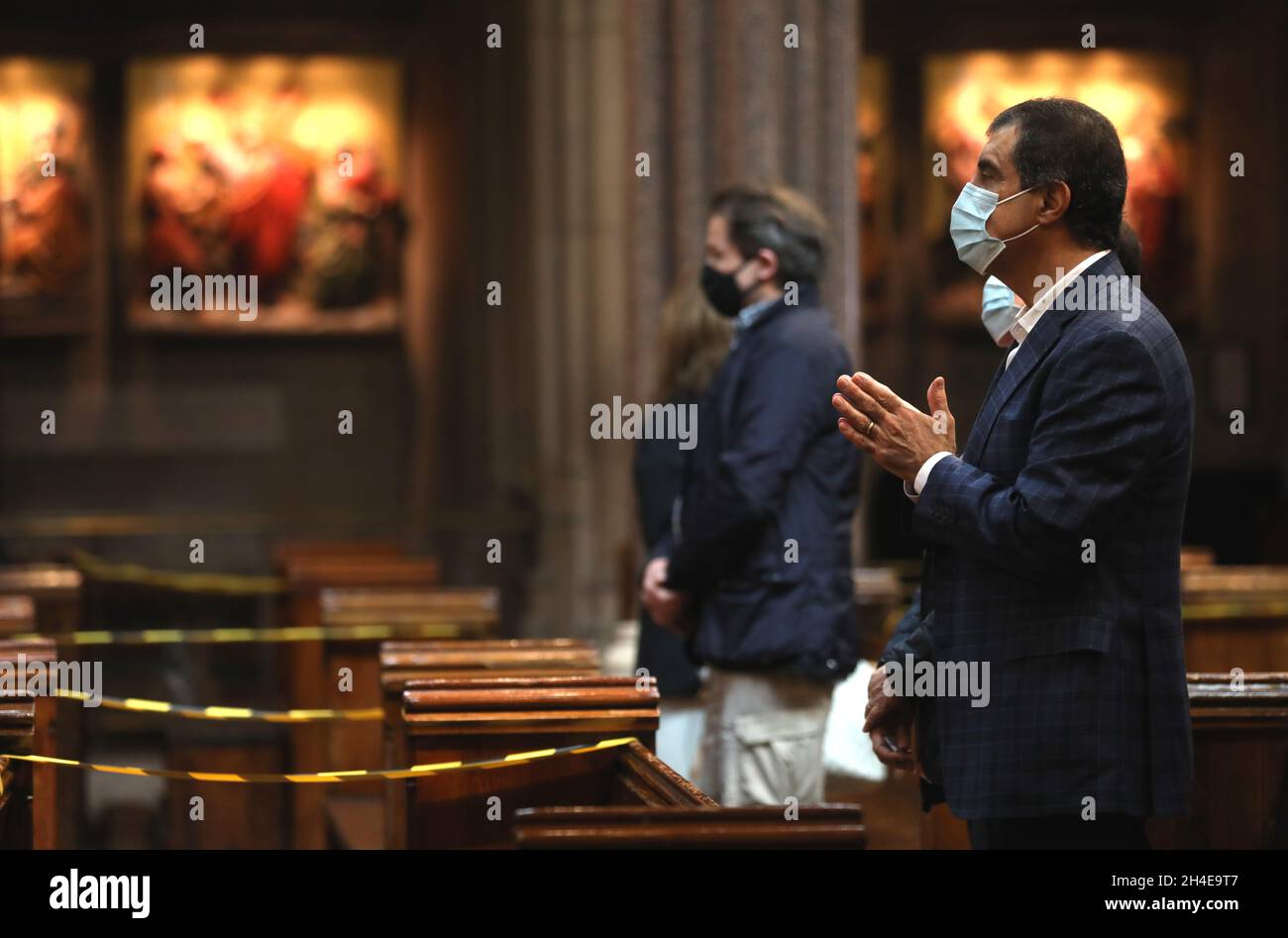 Churchgoers wearing a protective face mask as Personal Protective ...