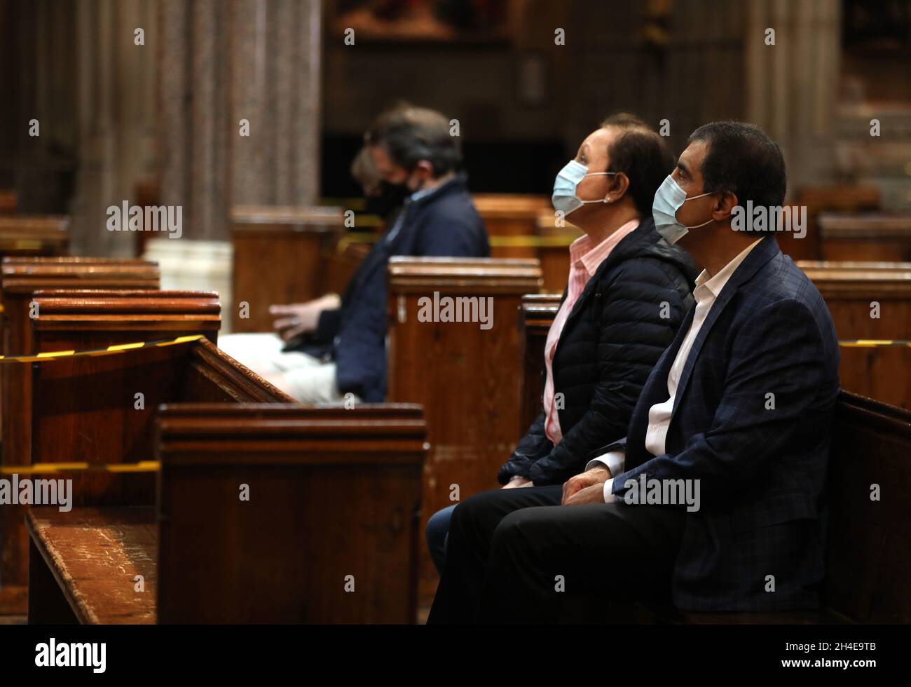 Churchgoers wearing a protective face mask as Personal Protective ...