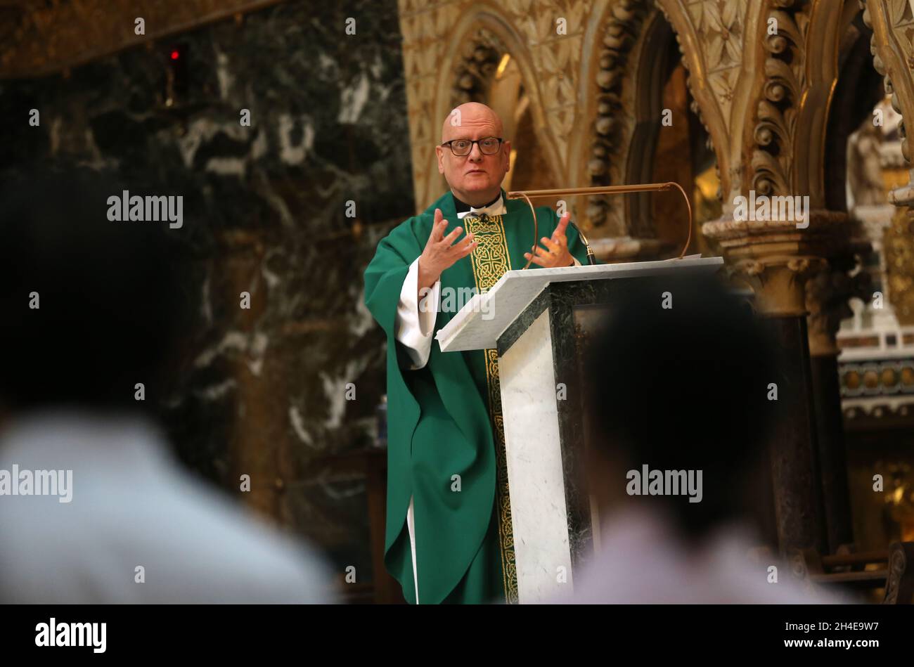 Catholic priest, Fr Chris Pedley, celebrates a Sunday mass at the ...