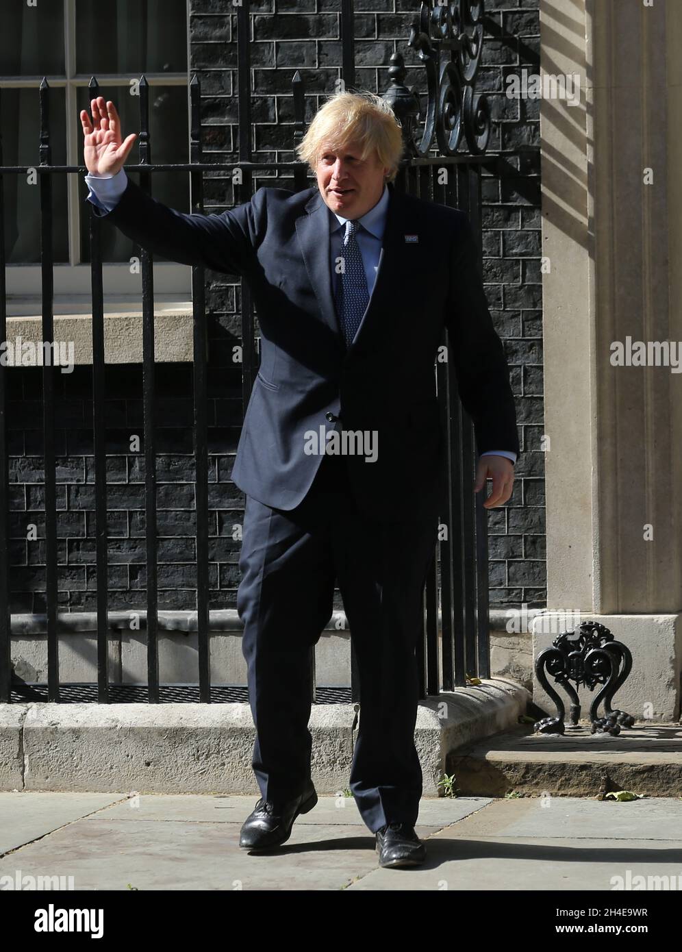 Prime Minister Boris Johnson waves outside 10 Downing Street, London ...