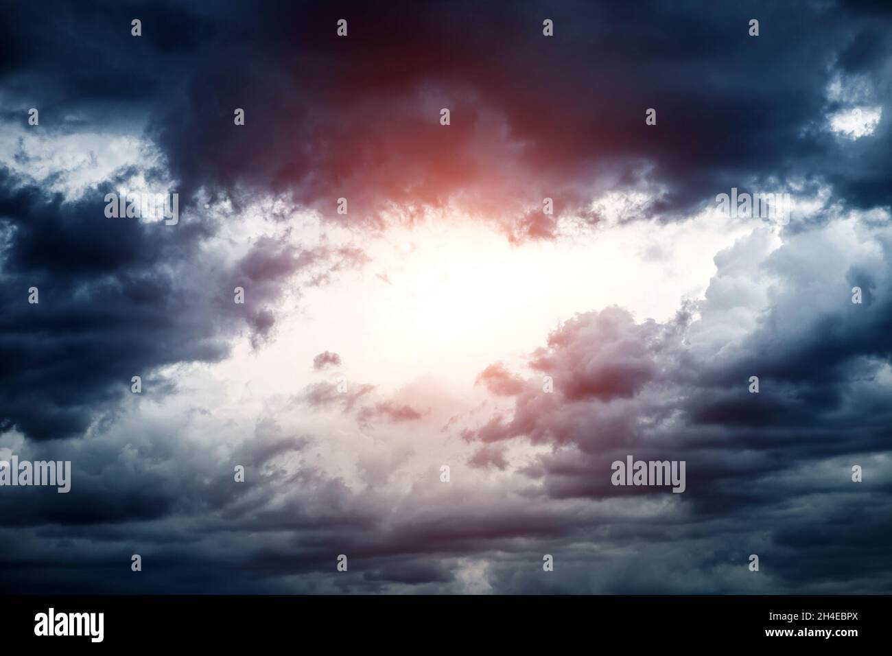 Red Sunlight in the Dark and Dramatic Storm Clouds Stock Photo - Alamy