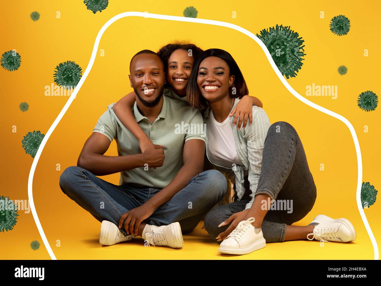 Happy african american parents and daughter hugging and smiling ...
