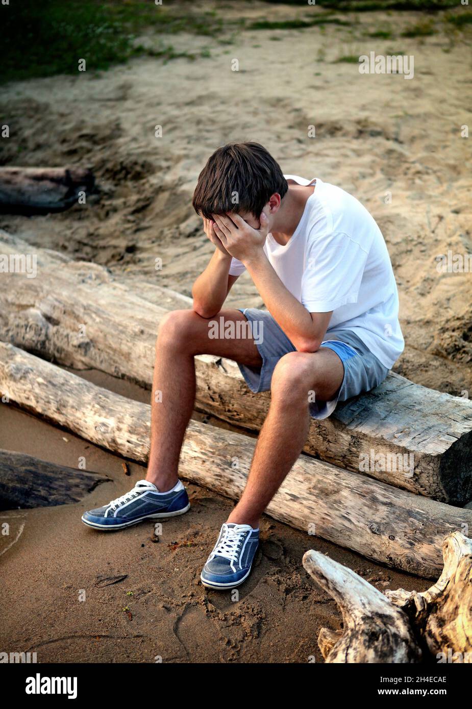 Sad Young Man on the Nature Background Stock Photo - Alamy