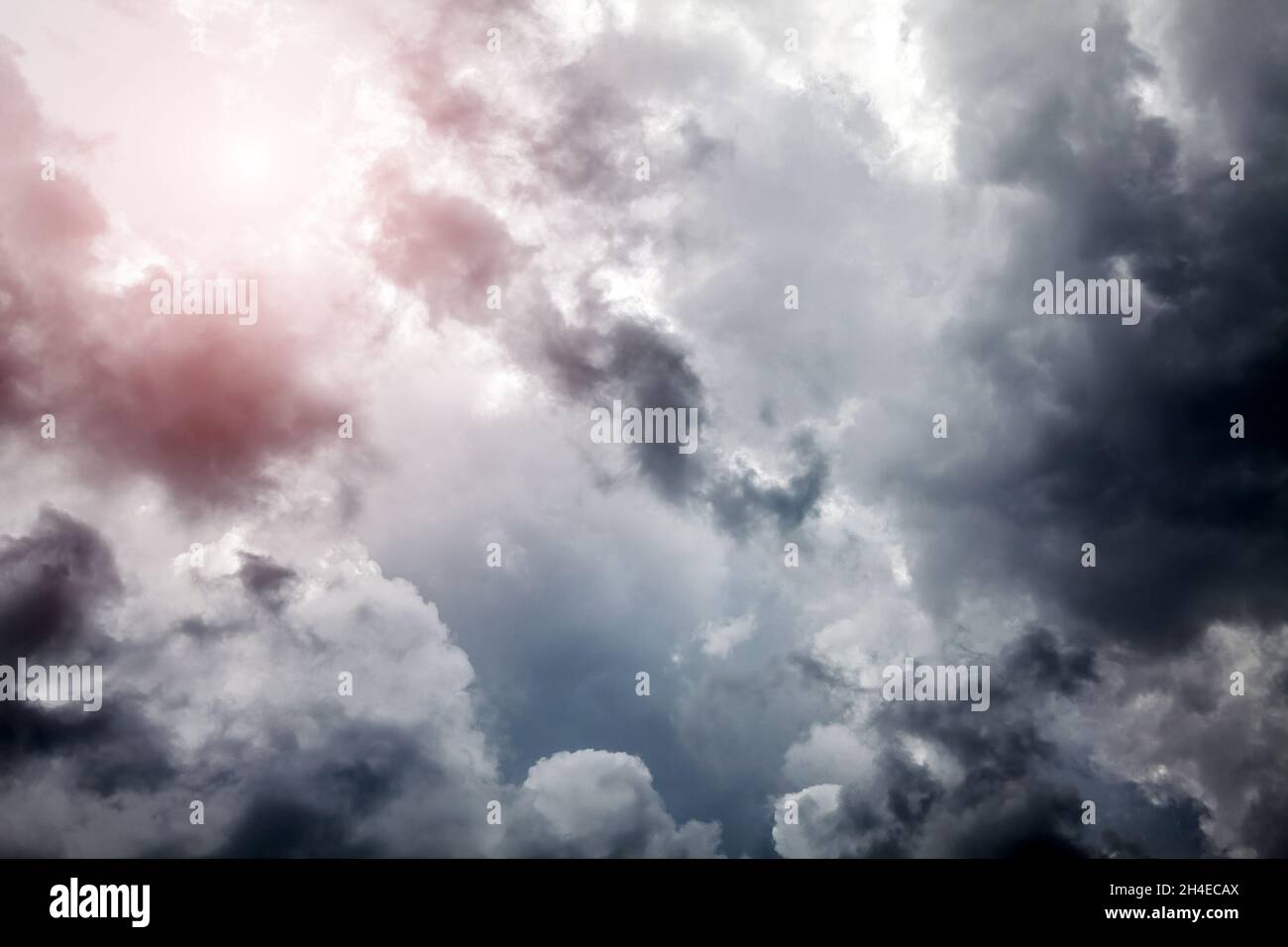 Red Sunlight in the Dark and Dramatic Storm Clouds Stock Photo - Alamy