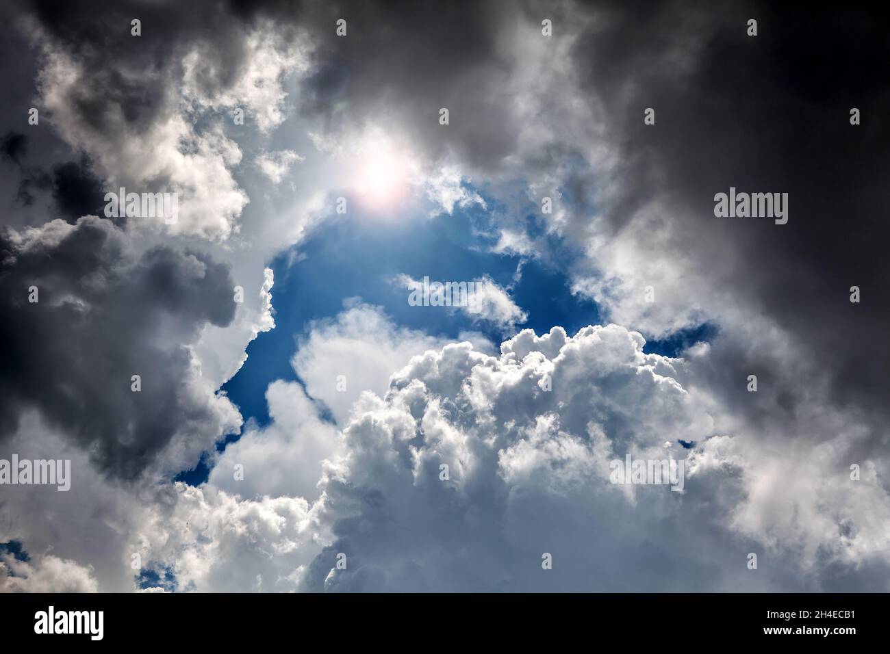 Dramatic Storm Clouds Area Background with Sunlight Stock Photo - Alamy