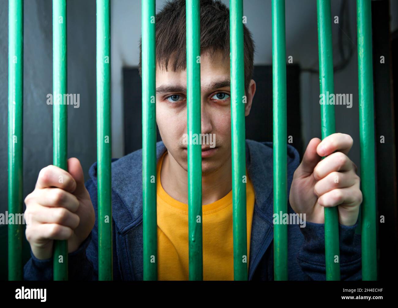 Criminal behind bars in jail hi-res stock photography and images - Alamy