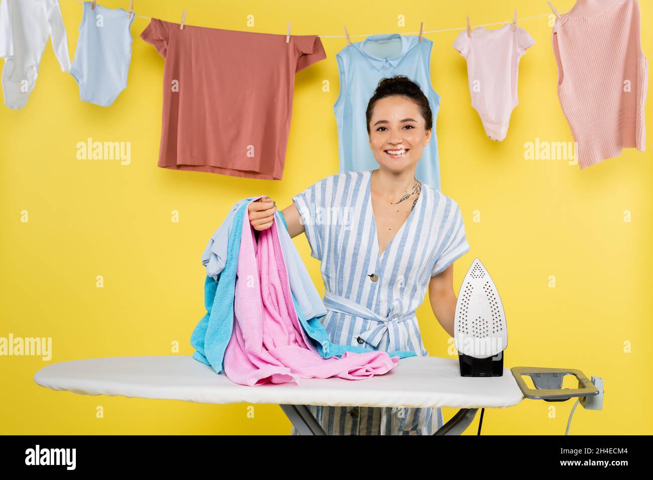 Woman look into the camera ironing hi-res stock photography and images ...