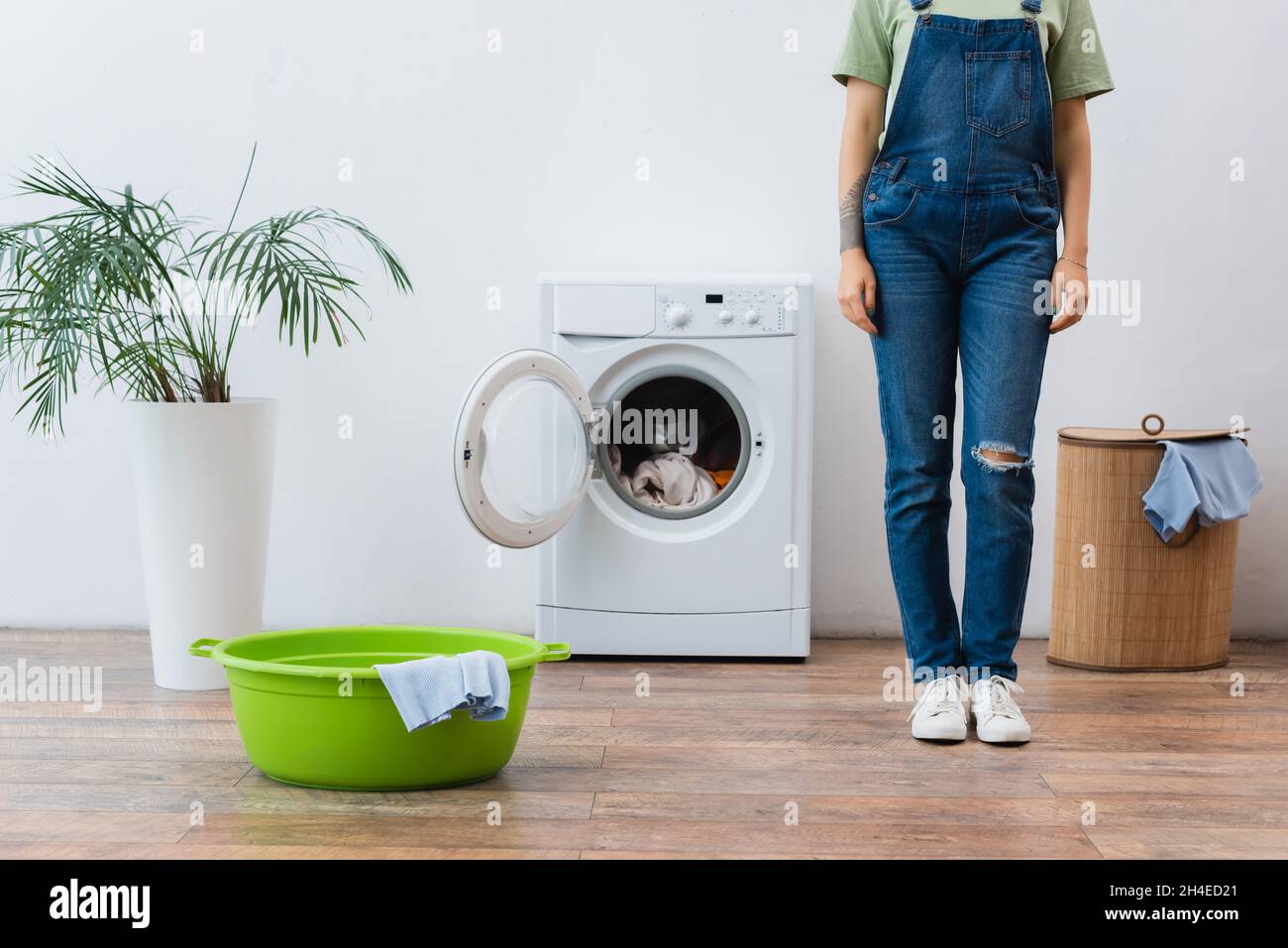 Person in green overalls hi-res stock photography and images - Alamy