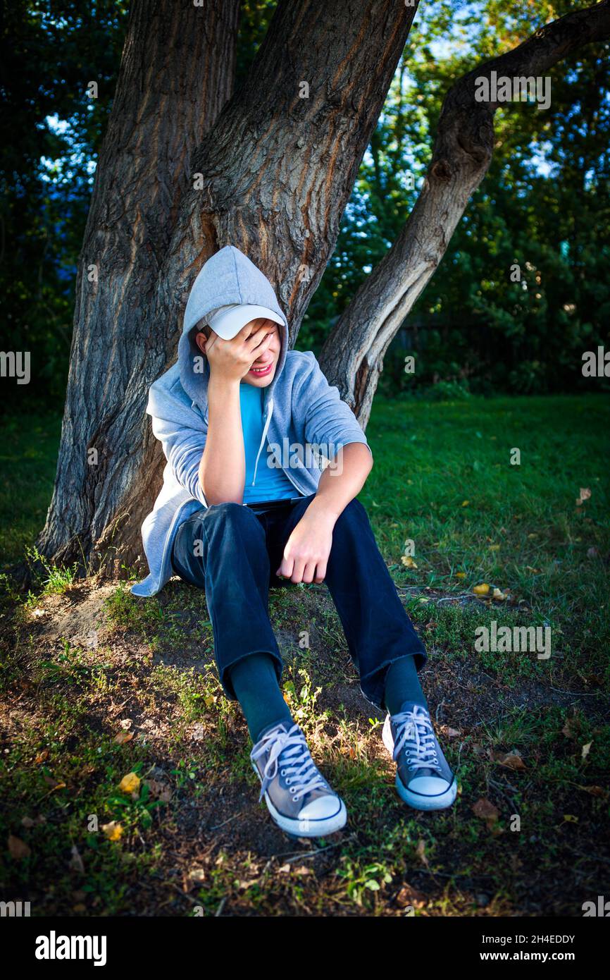 Teenager under hi-res stock photography and images - Alamy