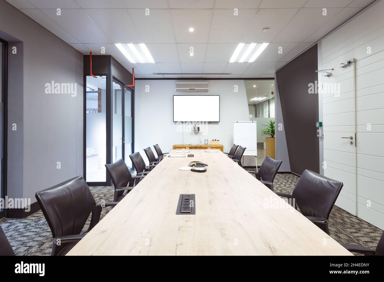 Interior of empty conference room with tv, desk and chairs in modern ...