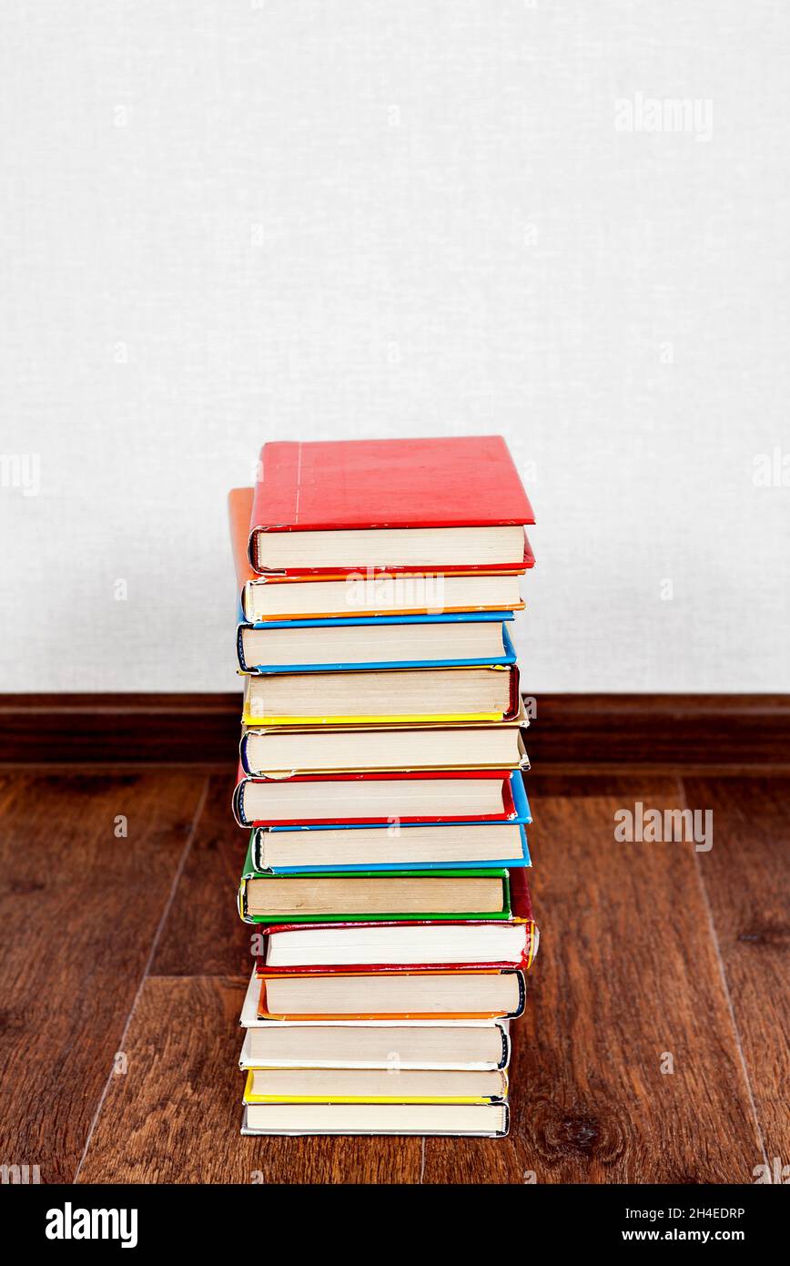 Pile of the Books on the Floor closeup Stock Photo - Alamy