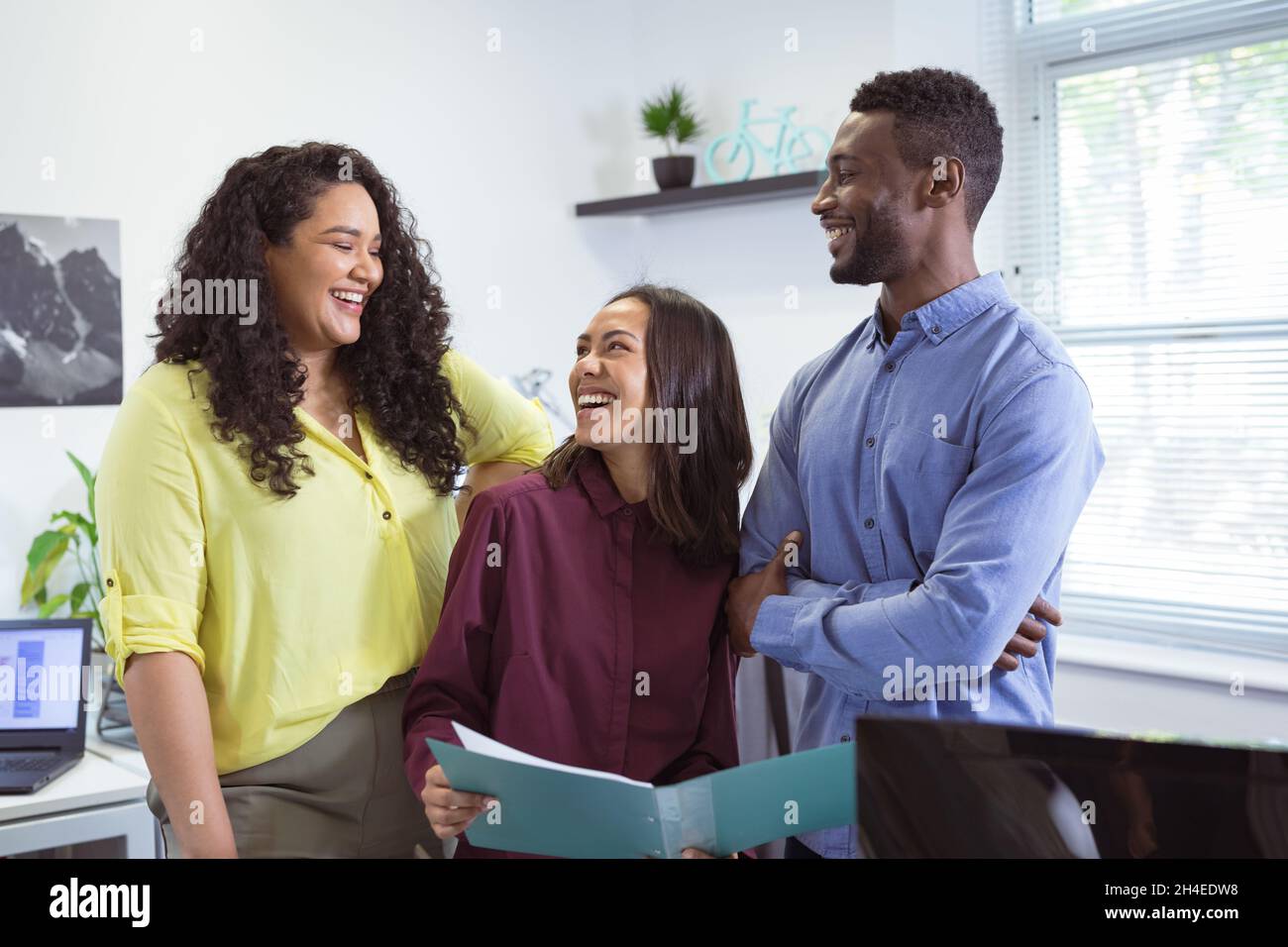 Happy diverse group of business people working together, discussing ...