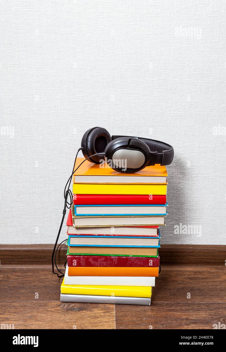Headphones and a Books on the Floor closeup Stock Photo - Alamy