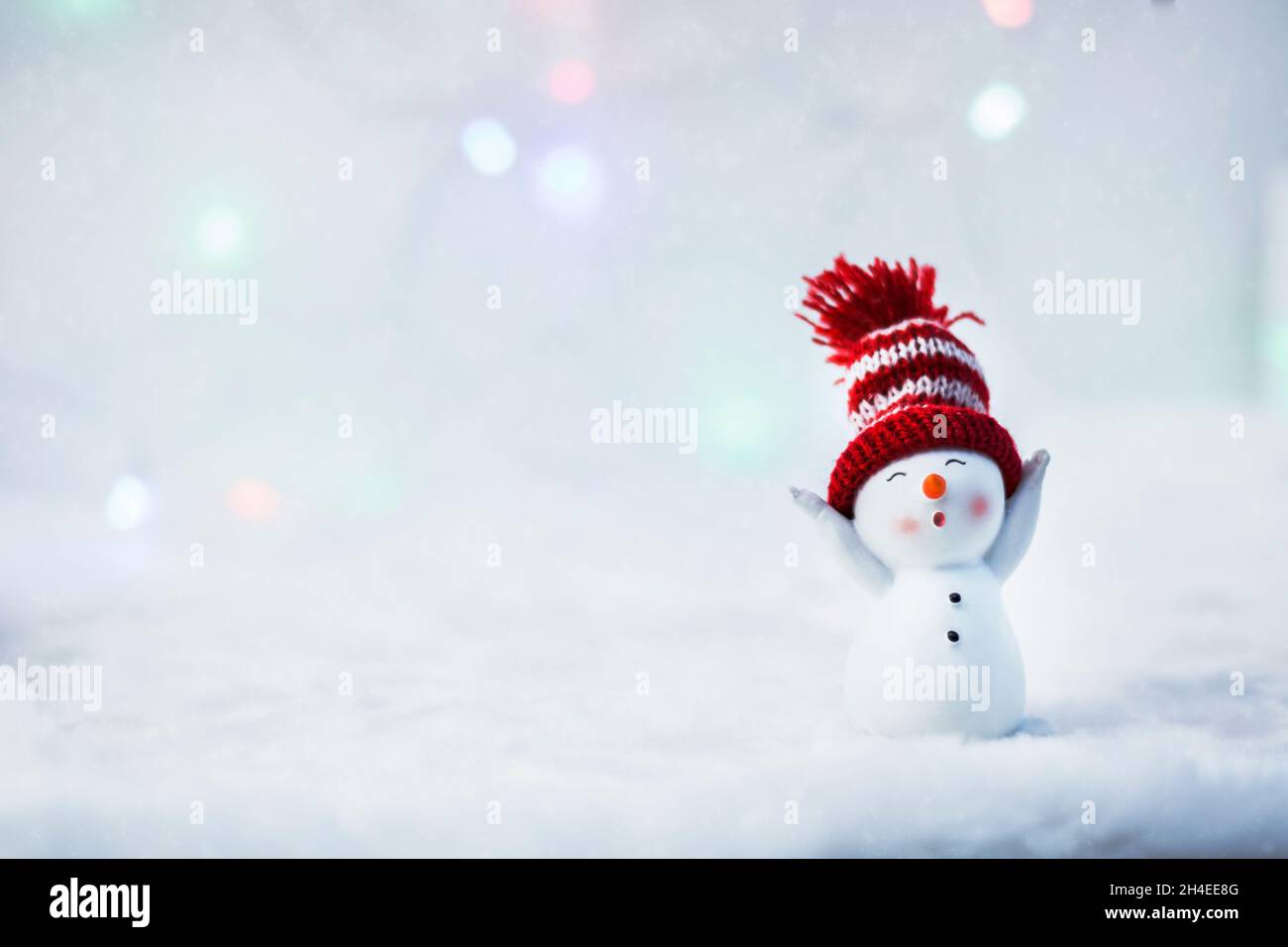 Happy snowman standing in winter christmas landscape. Merry christmas ...