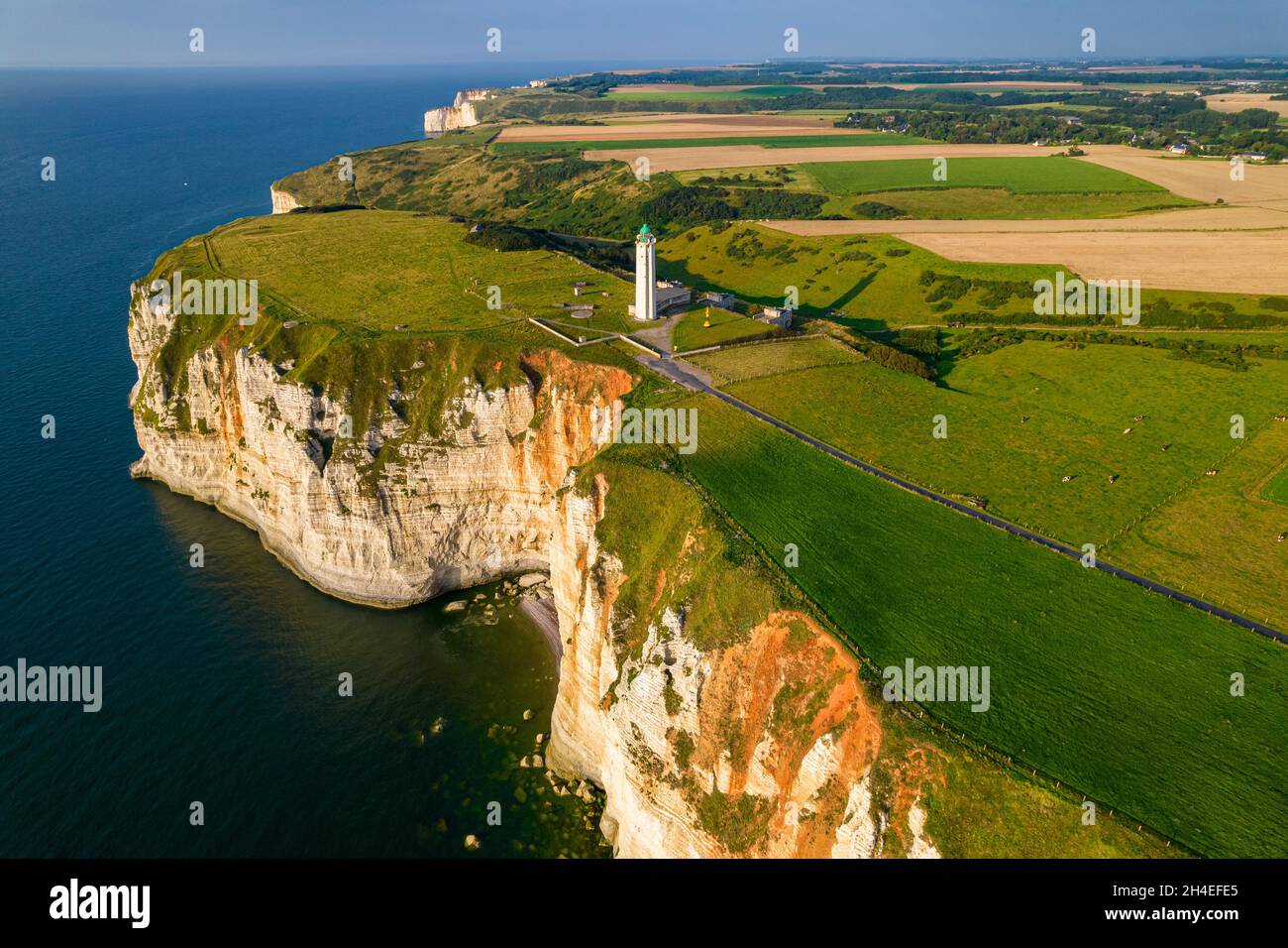 Aerial shot of Antifer lighthouse and limestone cliffs in Normandy ...