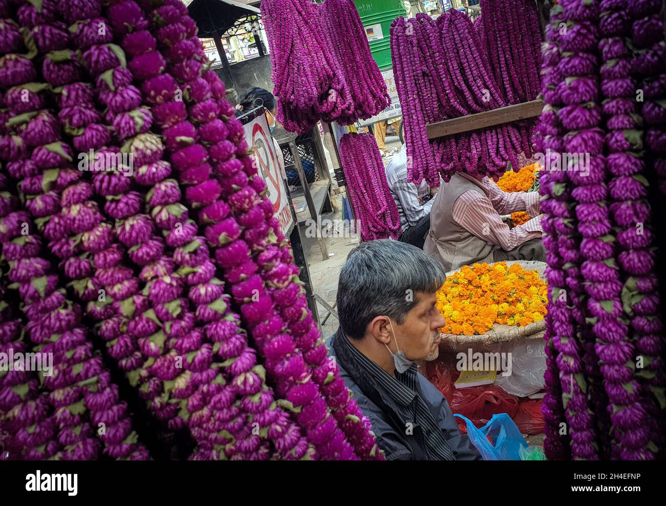 Kathmandu, Bagmati, Nepal. 2nd Nov, 2021. A local vendor sells garland ...