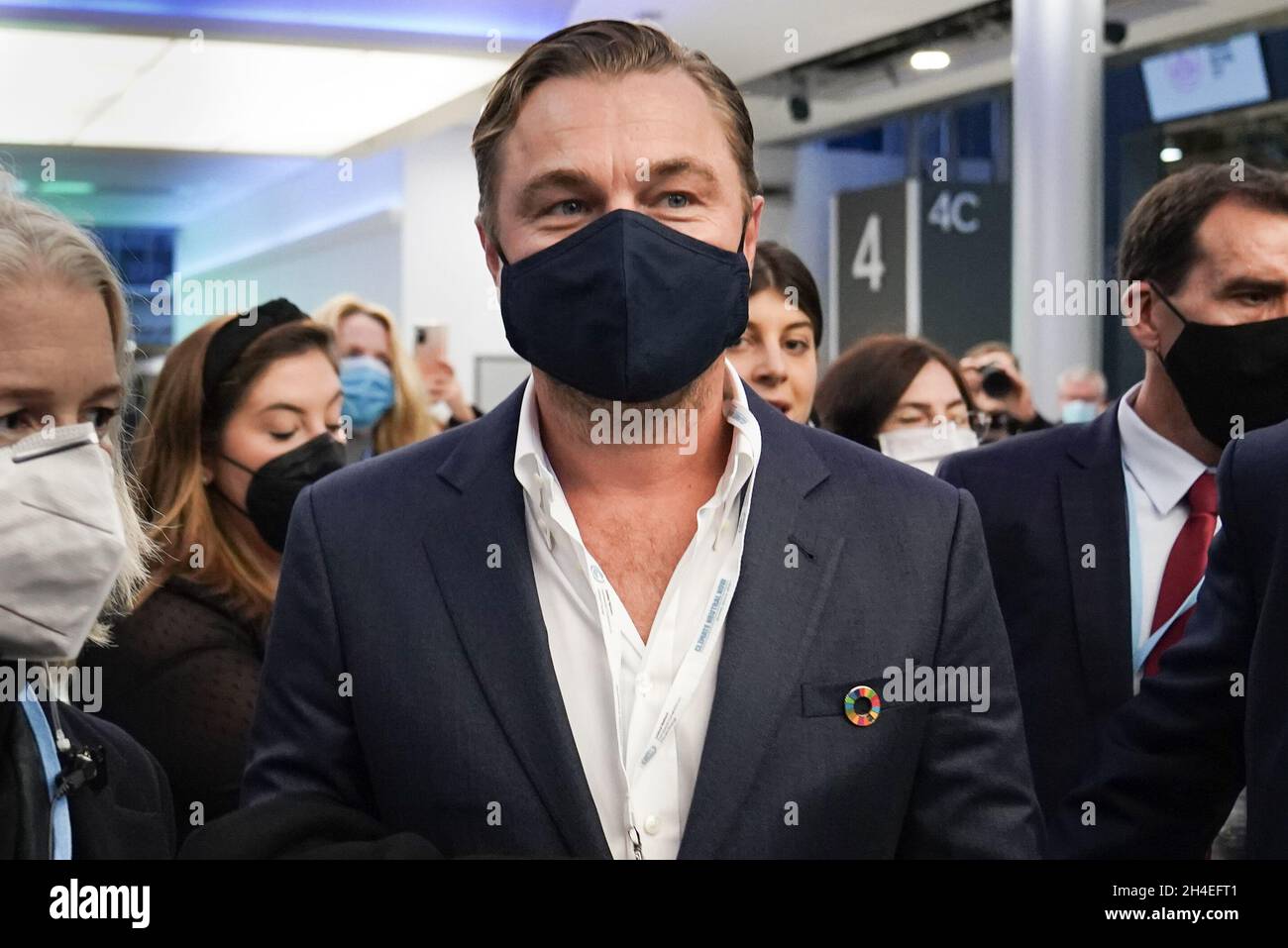 Leonardo DiCaprio walks through the exhibition hall after attending an ...