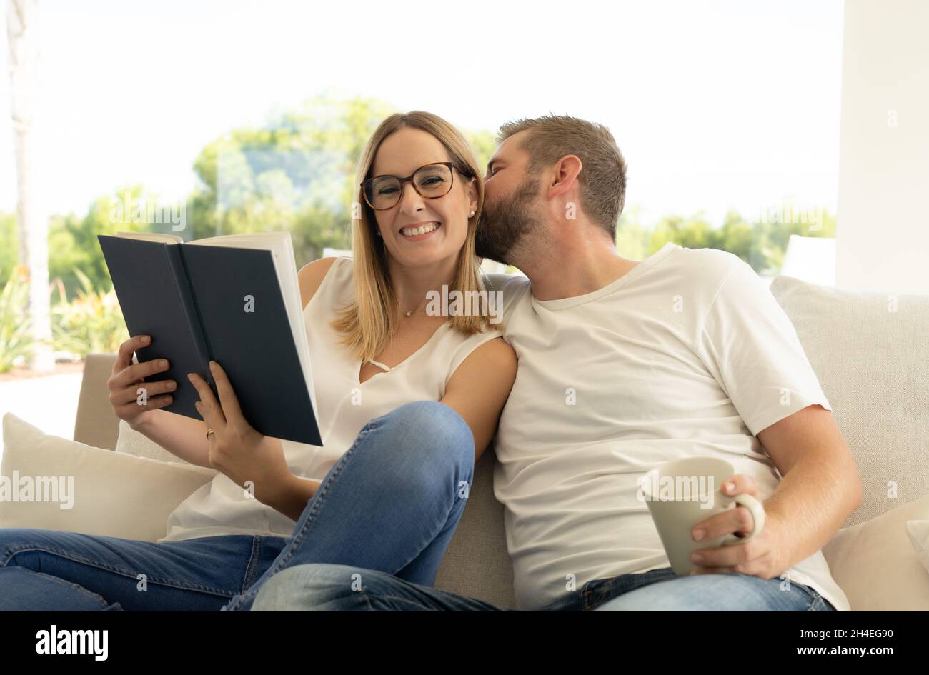 Spending nice time at home. Beautiful young loving couple bonding to ...