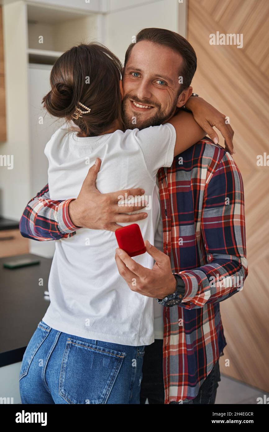 Happy adorable man with charming lady is surprised during romantic date ...