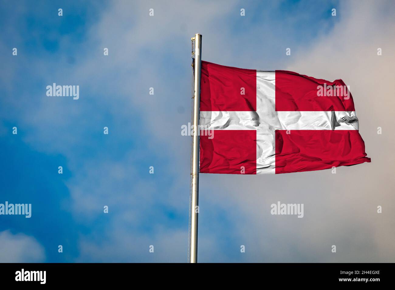 A Flag of Denmark flying on a Flagpole against the Sky Stock Photo - Alamy