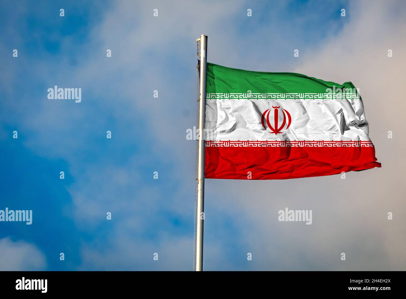 Iran flag on flag pole hi-res stock photography and images - Alamy