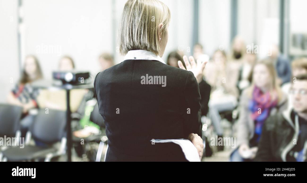 Female public speaker giving talk at Business Event Stock Photo - Alamy