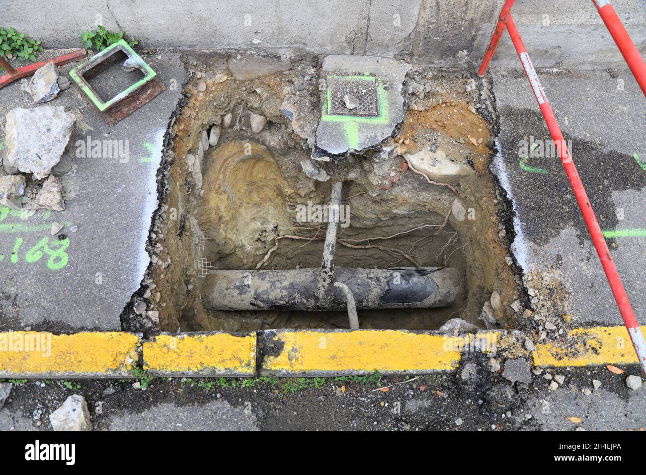 Excavating old underground gas pipeline under sidewalk in France. Gas ...