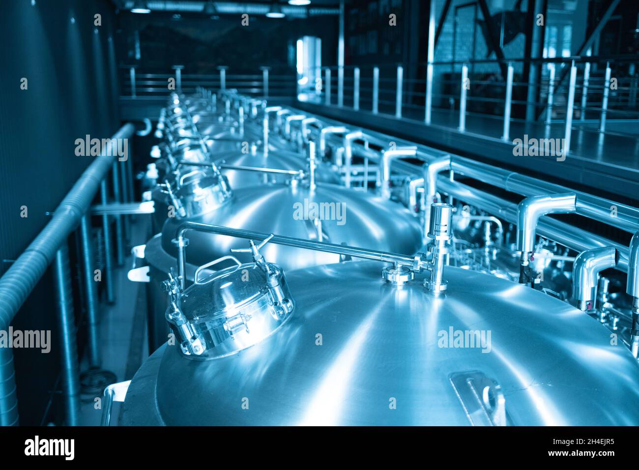 Private microbrewery. Modern beer plant with brewering kettles, tubes ...