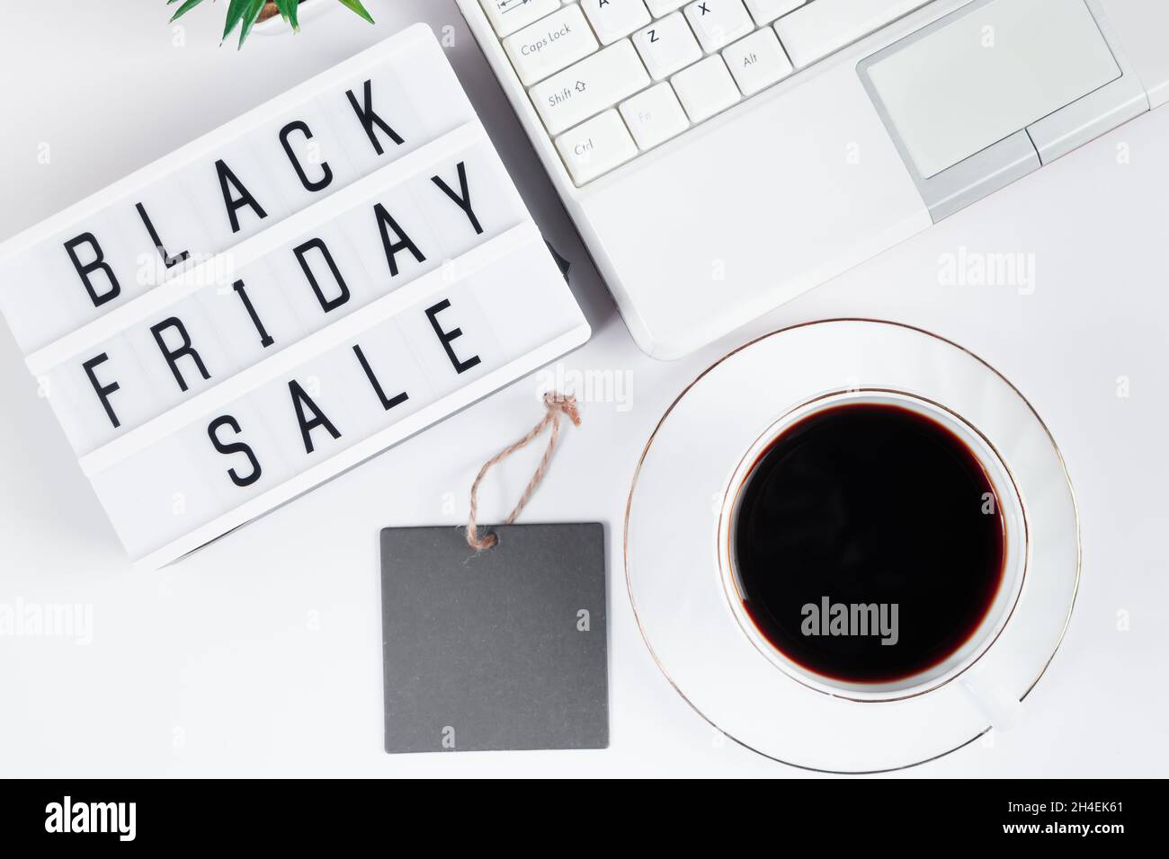 Black Friday concept. Laptop and coffee cup on white background. Online ...