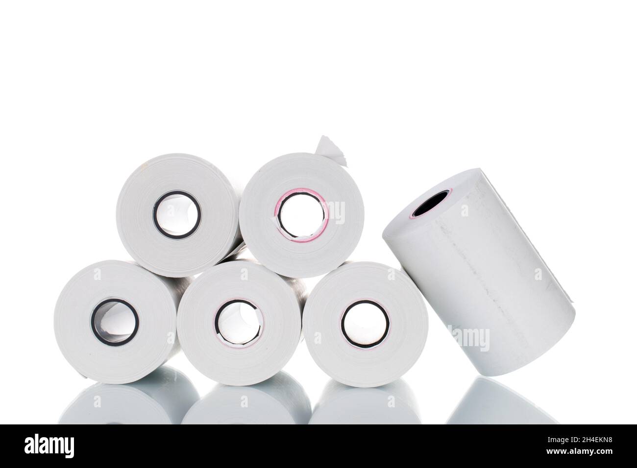 Several rolls of paper cash register tape, close-up isolated on white ...