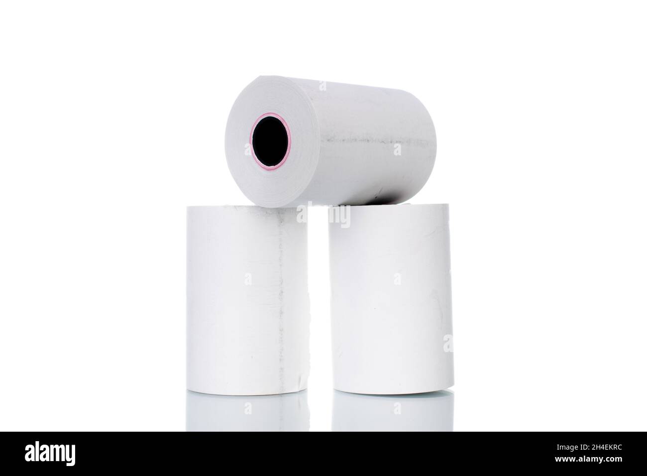 Three rolls of paper cash register tape, close-up isolated on white ...