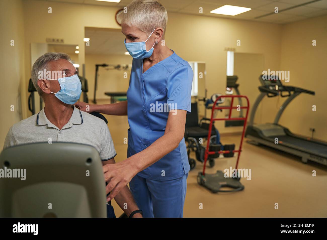 Stroke patient restoring movement skills in rehab center Stock Photo ...