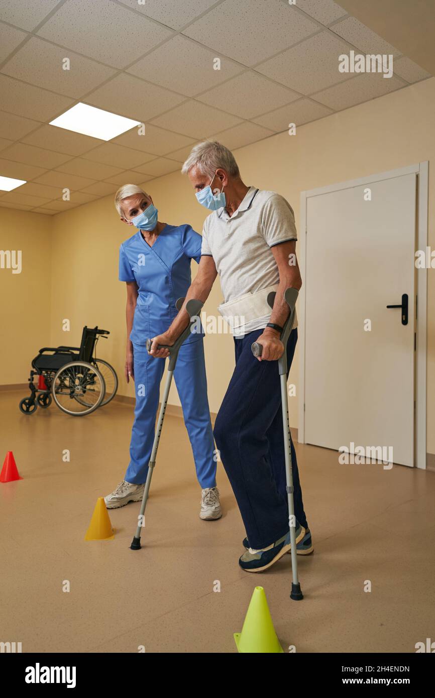 Stroke patient restoring mobility in rehab center Stock Photo - Alamy