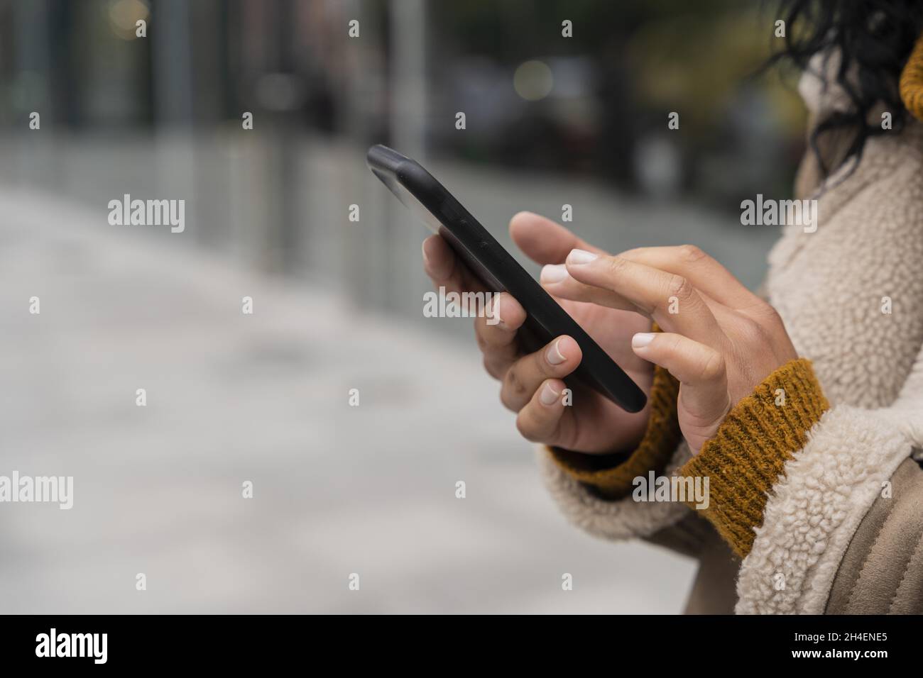 woman using her smartphone outside with copy space. Resolution and high ...