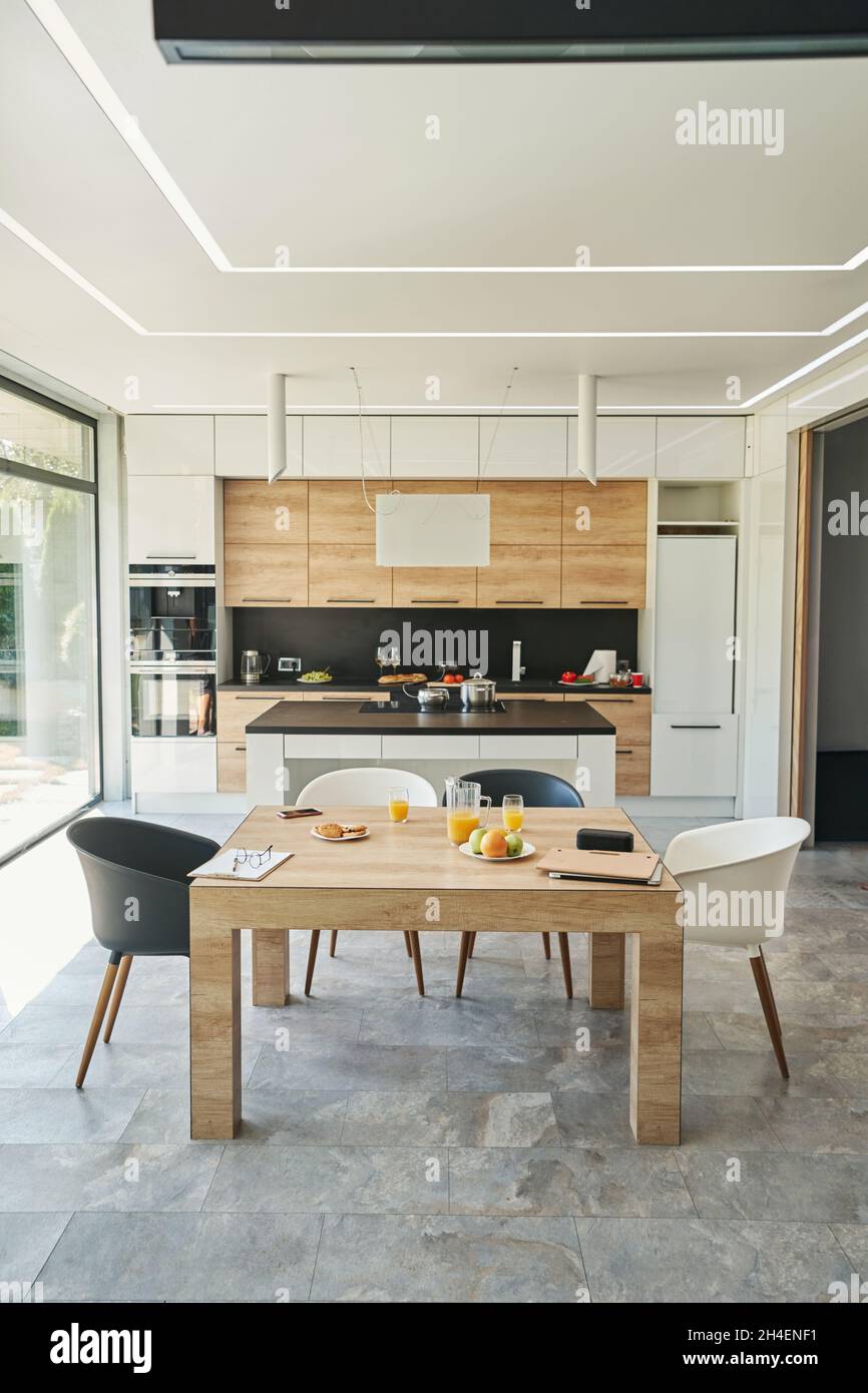 Empty kitchen with table and two chairs in the front Stock Photo - Alamy