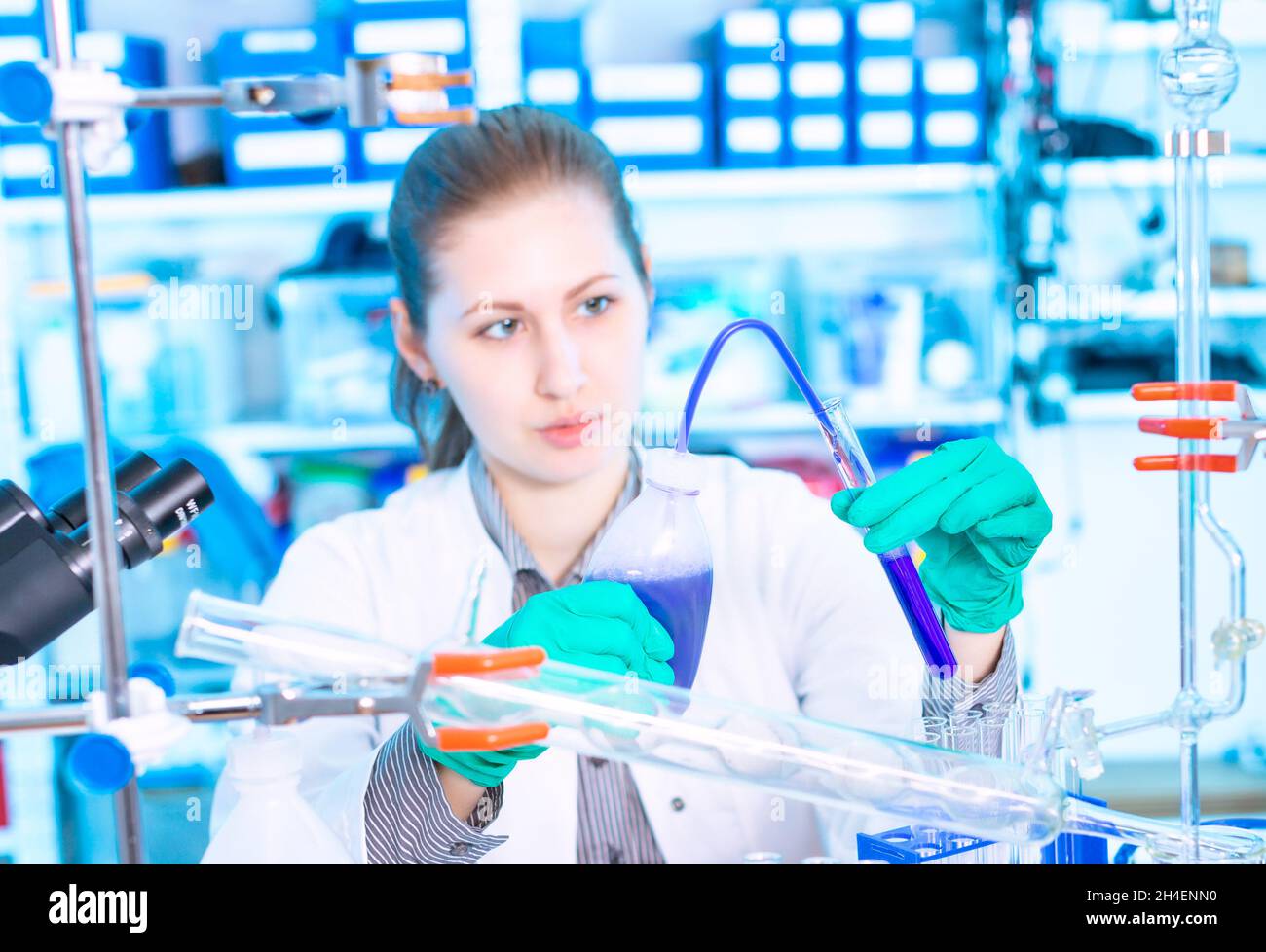 Young woman in a pharmacological laboratory. Antiallergic drug ...