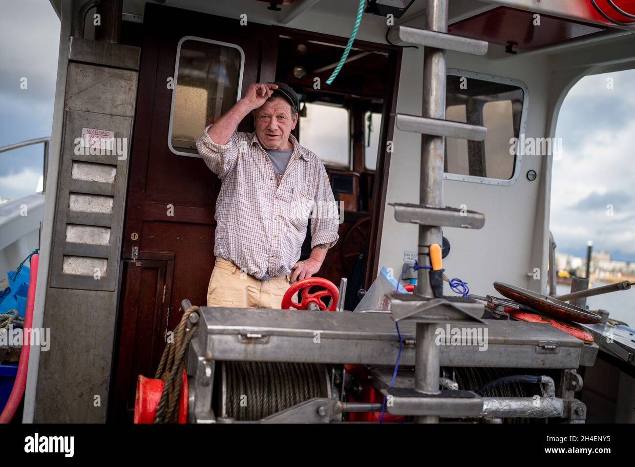 Fisherman Phil Channing unloads his catch of scallops at the harbour in ...