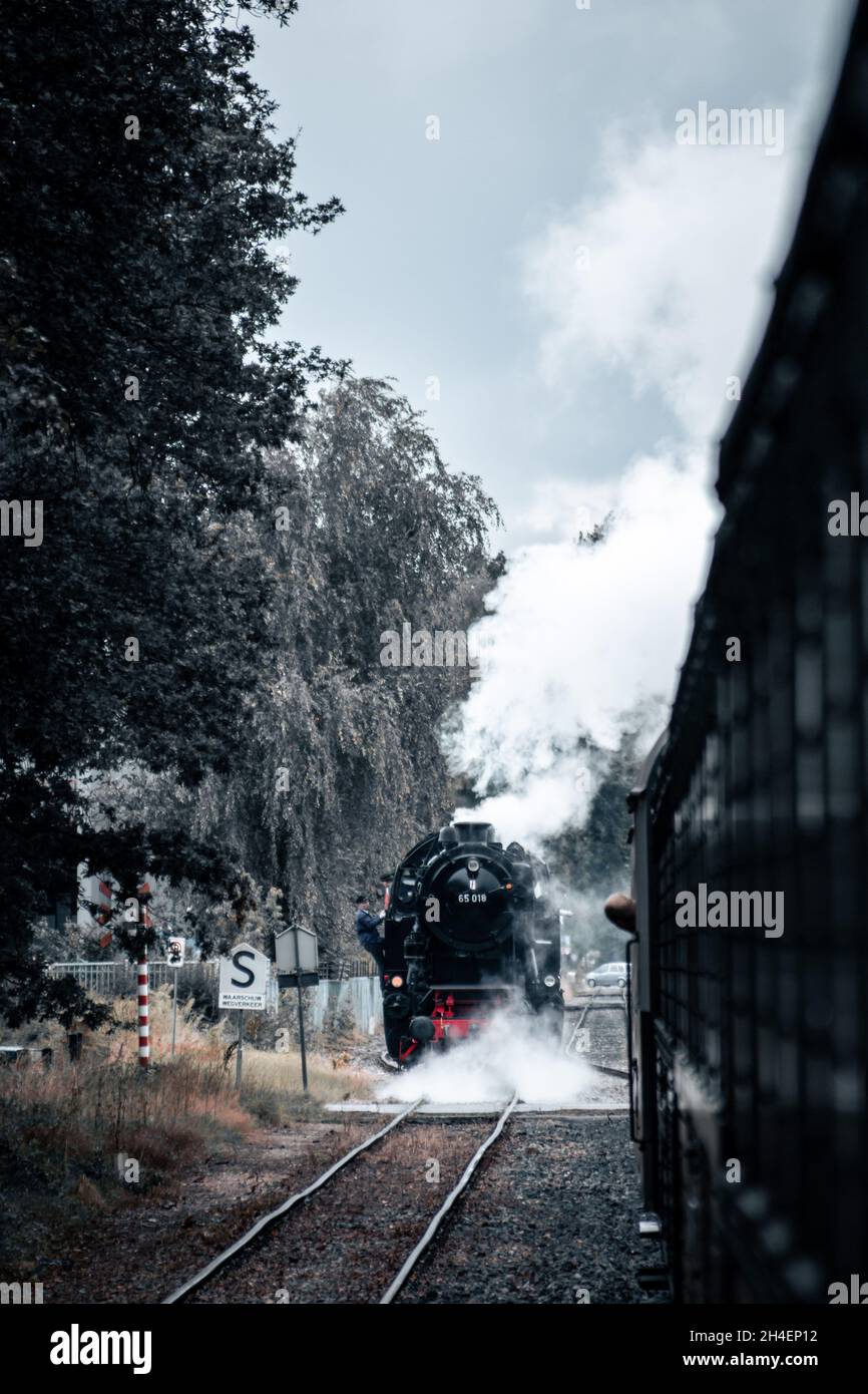 Closeup of an approaching steam engine on the railroad Stock Photo - Alamy