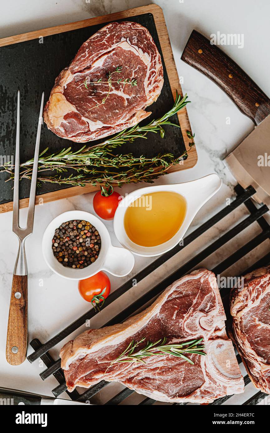 aged black angus beef steak ready to roast and serve Stock Photo - Alamy