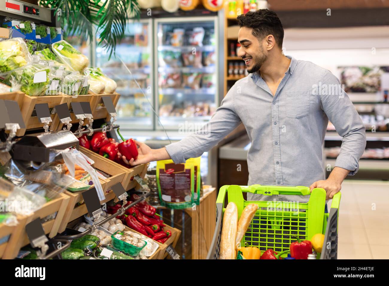 Middle Eastern Man Choosing Vegetables Shopping Food Products In ...