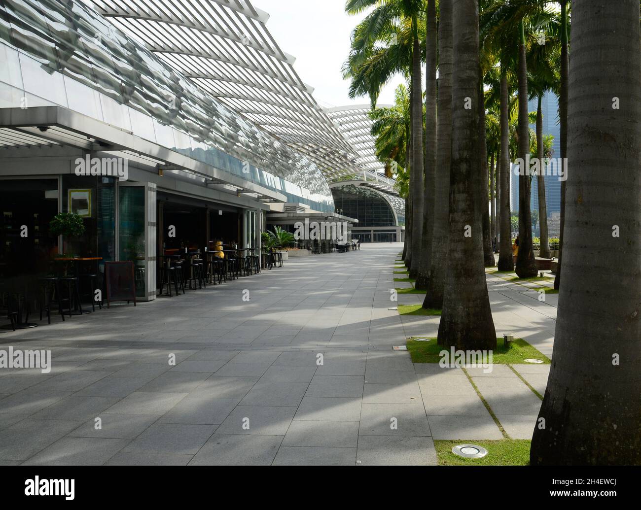 pedestrian passage way with cafe and landscaping Stock Photo - Alamy