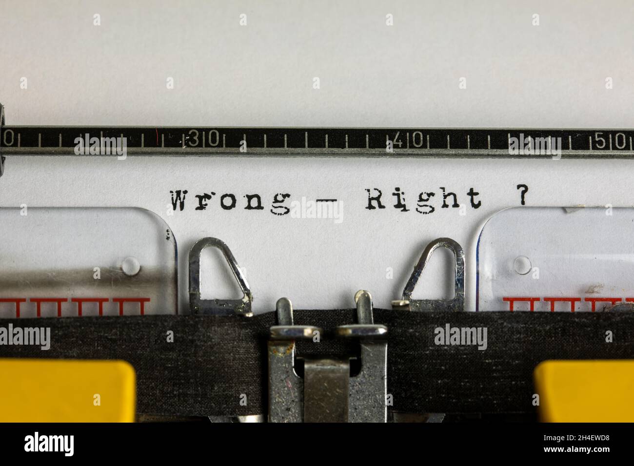 wrong - right ? written on an old typewriter Stock Photo - Alamy